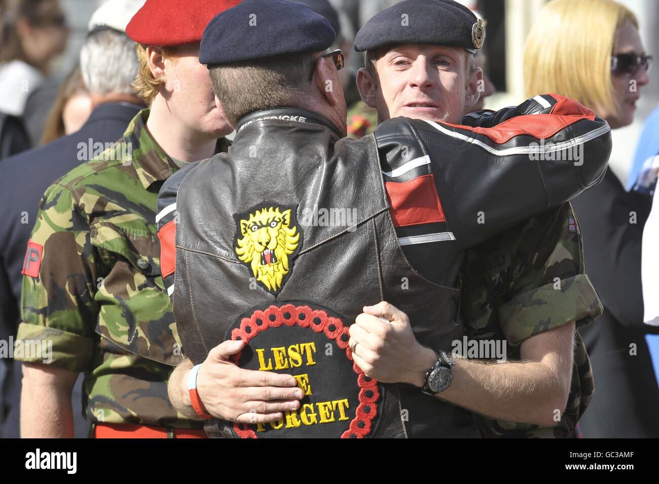 Sergeant Phil Reed gets a hug from a Royal British Legion rider, made ...