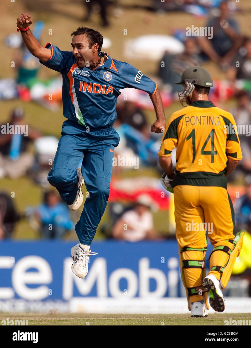 India's Amit Mishra celebrates dismissing Australia's Tim Paine during ...