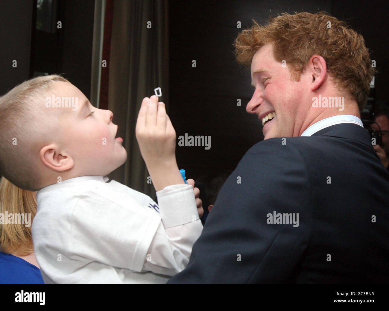 Prince Harry meets six year old Alex Burke from Manchester, winner of ...
