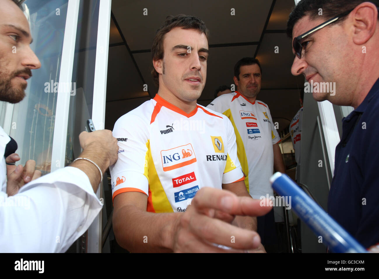 Renault Formula One driver Fernando sign autographs during second ...
