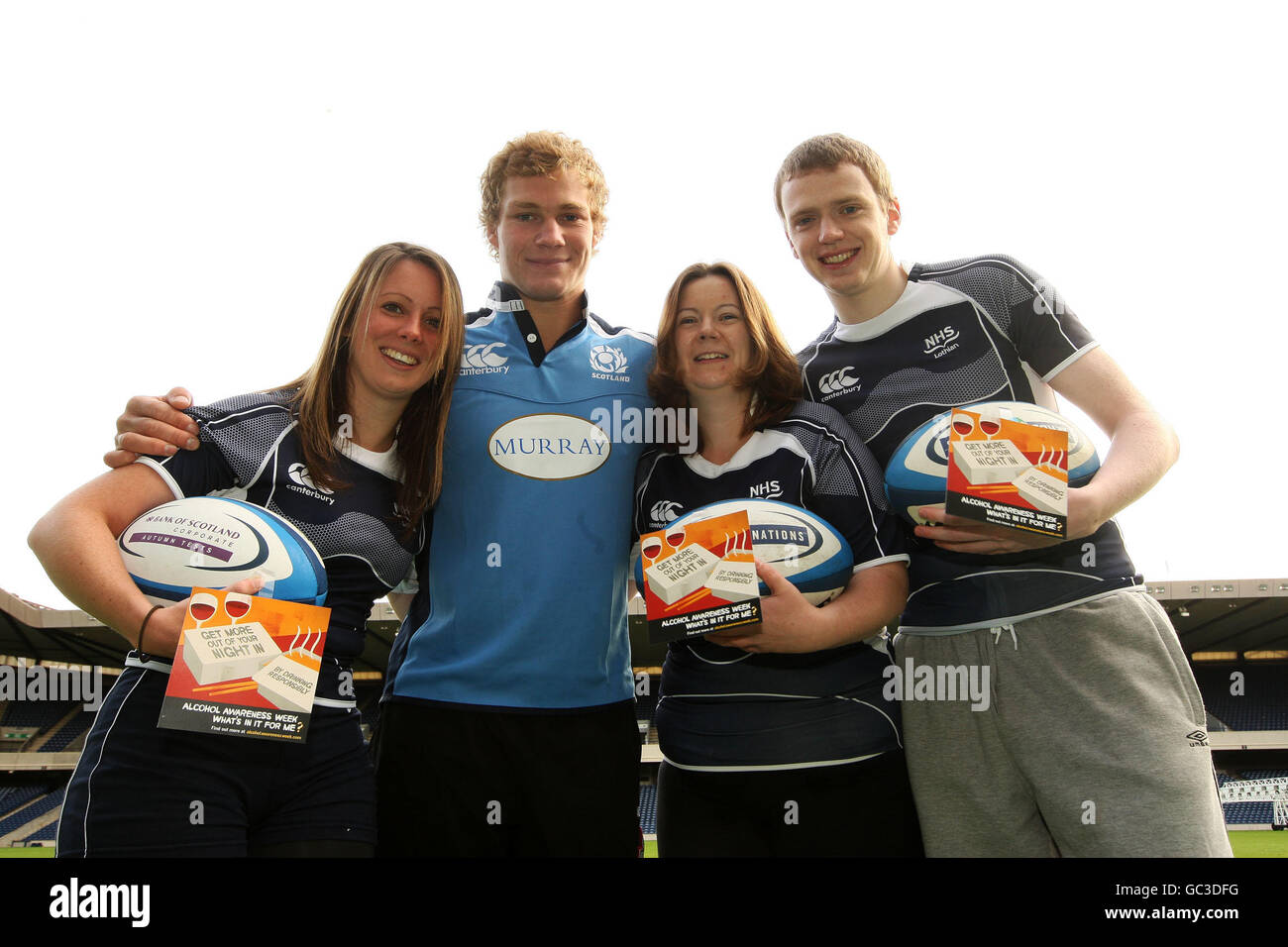 Scotland's Ross Rennie (2nd left) is joined by NHS Lothian Touch Rugby ...