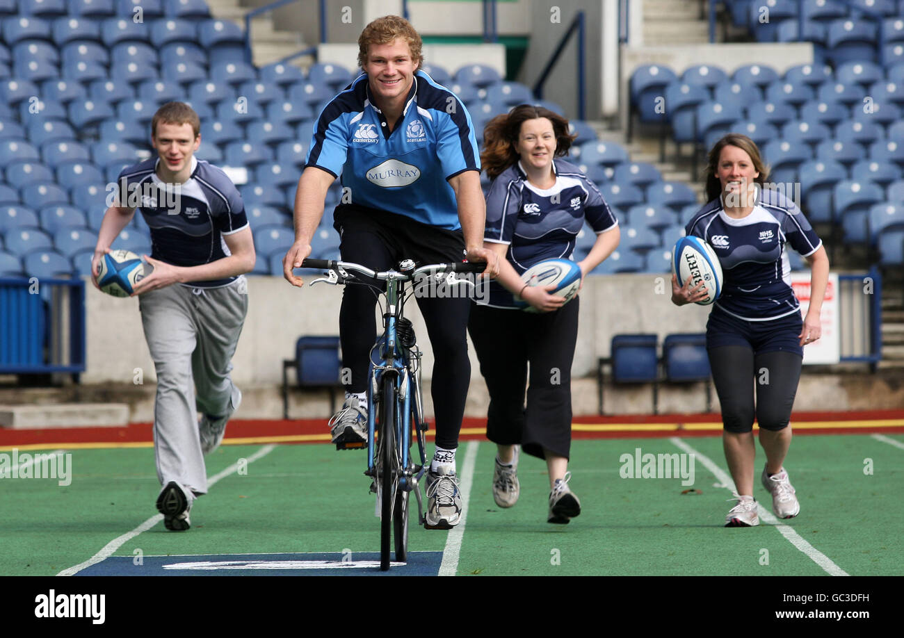 Scotland's Ross Rennie (2nd left) is joined by NHS Lothian Touch Rugby ...