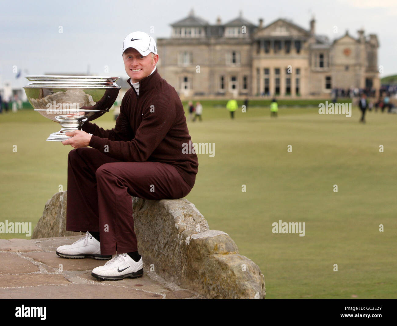 Simon Dyson holds his trophy, after winning the Alfred Dunhill Links ...