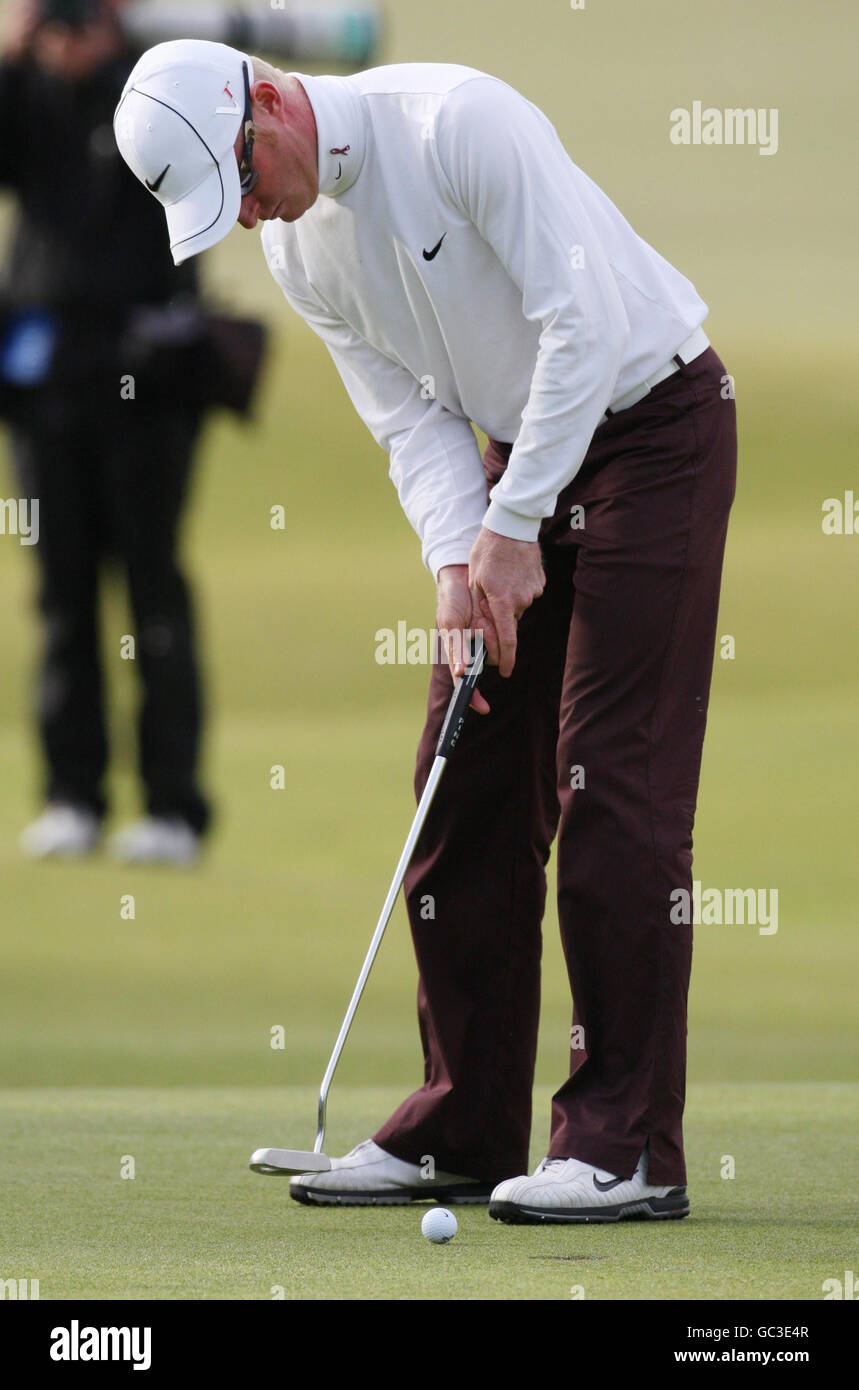 Simon Dyson makes his final putt on the 18th hole during the Alfred ...
