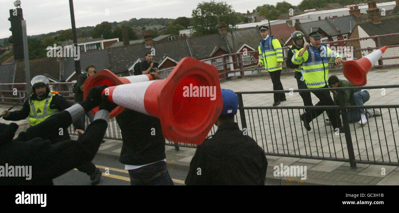 Police attempt to protect a man accused of being a member of a right ...