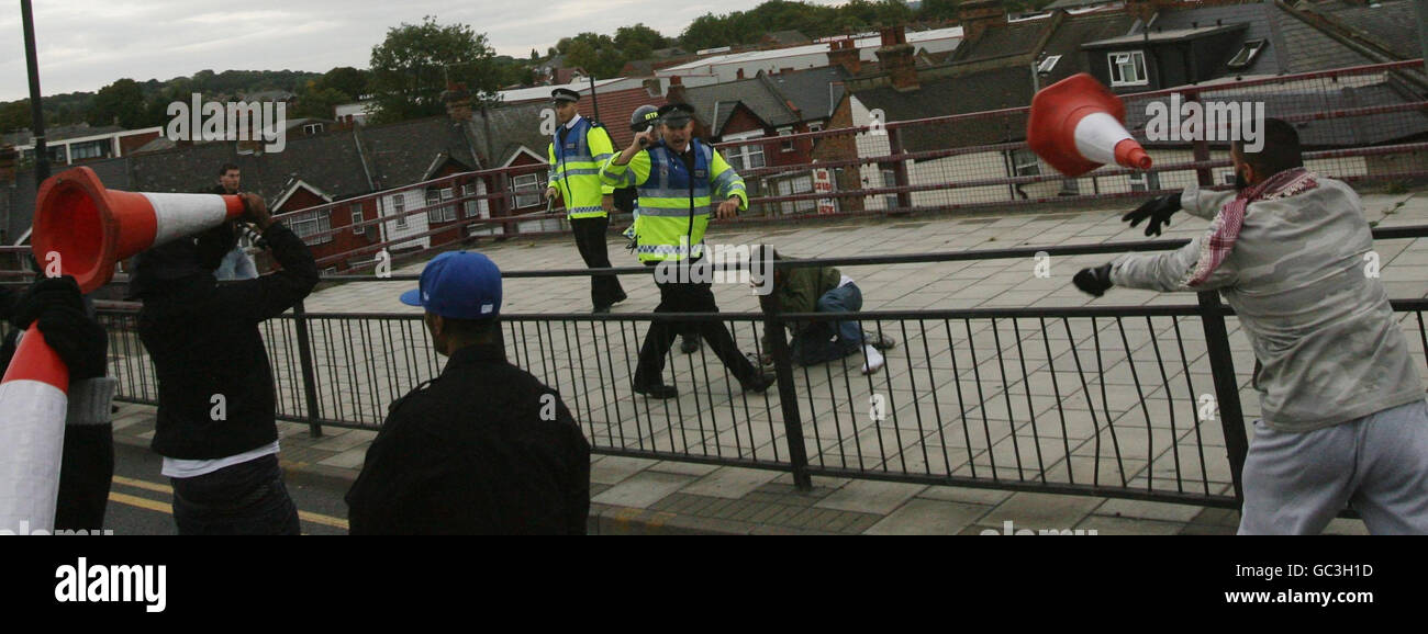 Police attempt to protect a man accused of being a member of a right ...