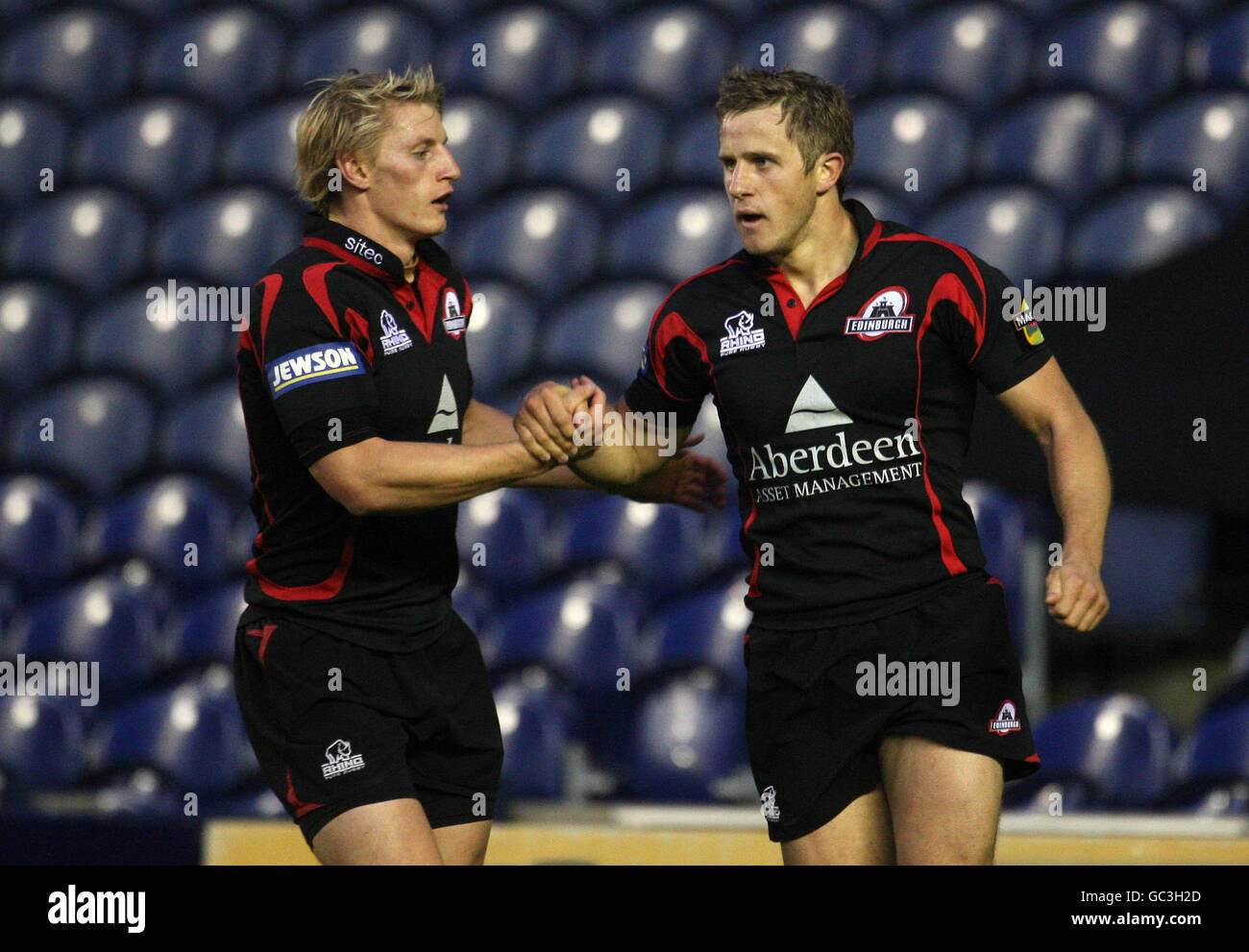Edinburgh's Mark Robertson (right) celebrates with teammate Ben Cairns ...