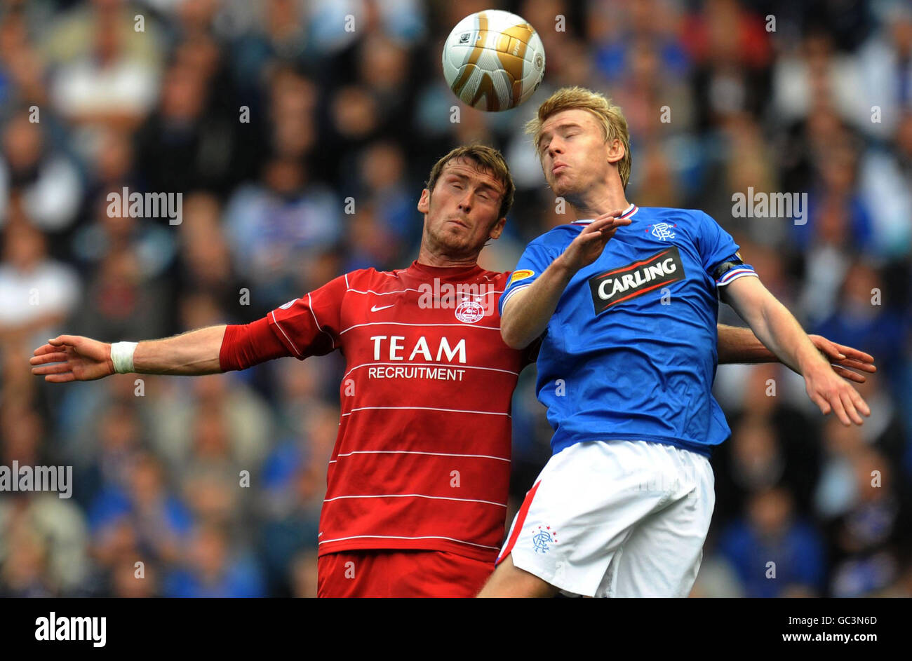 Aberdeen's Lee Miller and Rangers' Steven Smith battle for the ball ...