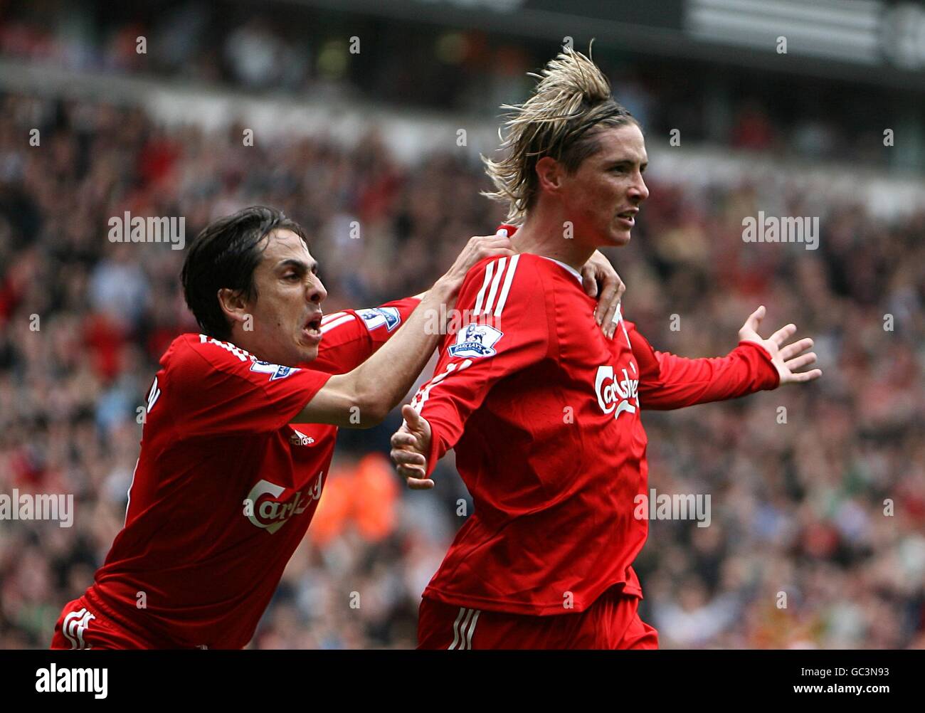 Liverpool's Fernando Torres (right) celebrates scoring his sides second ...