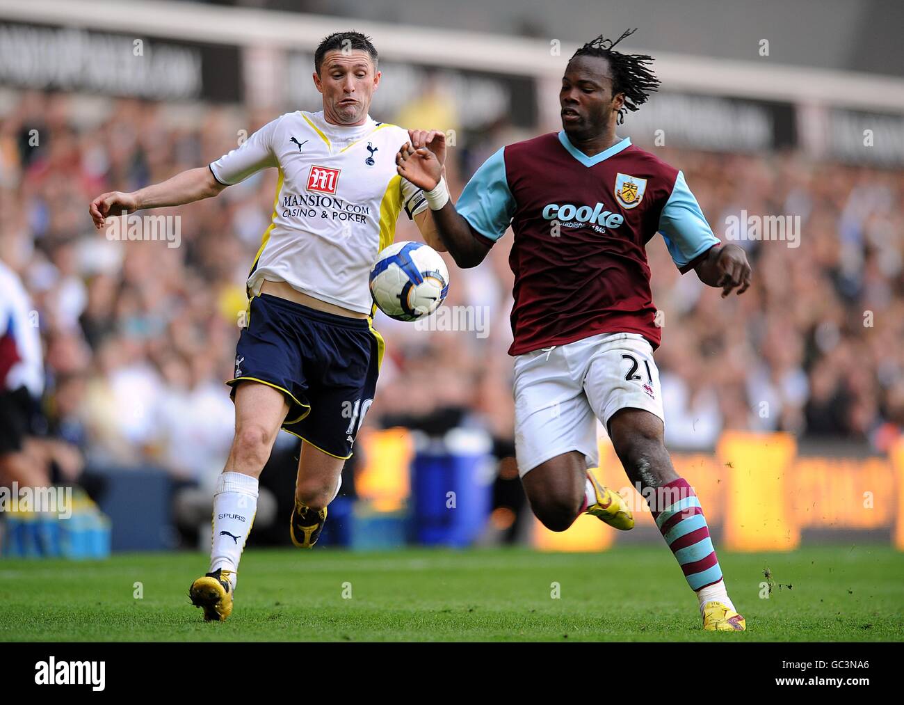 Burnley's Andre Bikey and Tottenham Hotspur's Robbie Keane (left ...