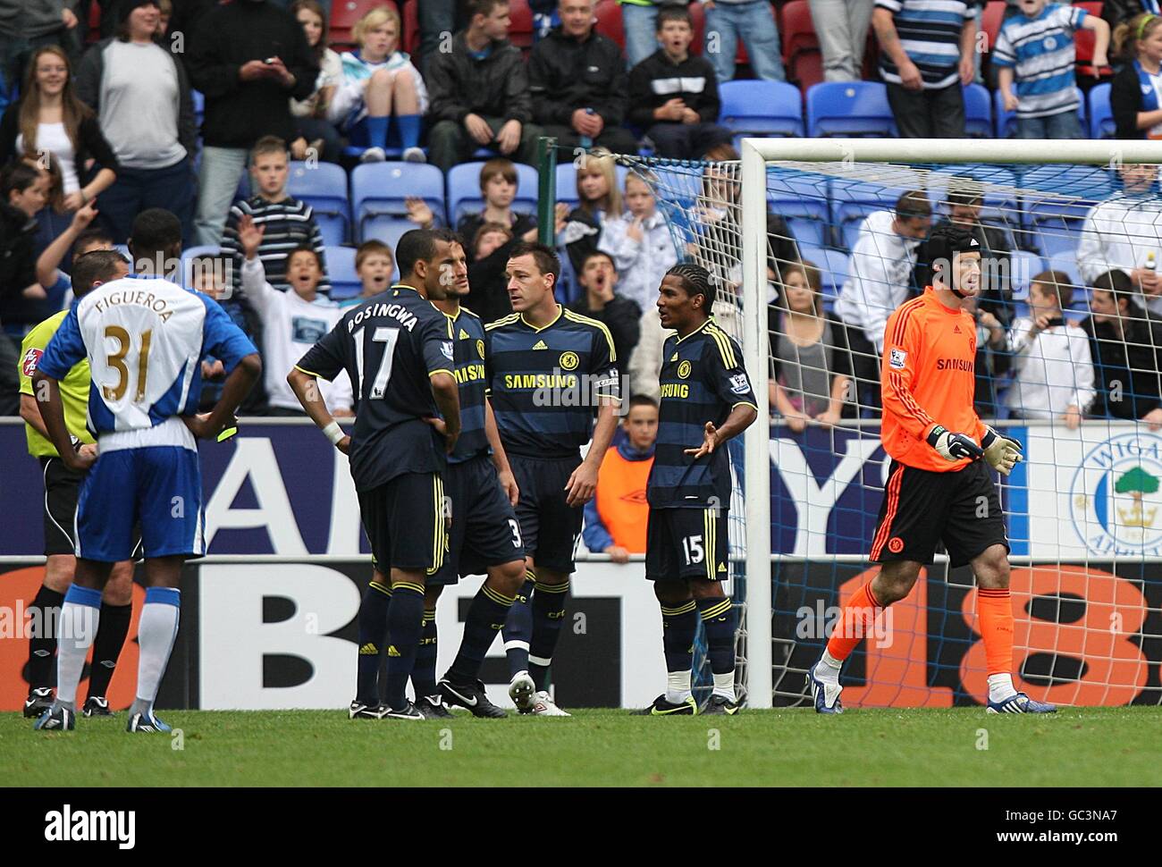 Chelsea goalkeeper Petr Cech (right) walks off the field of play after ...