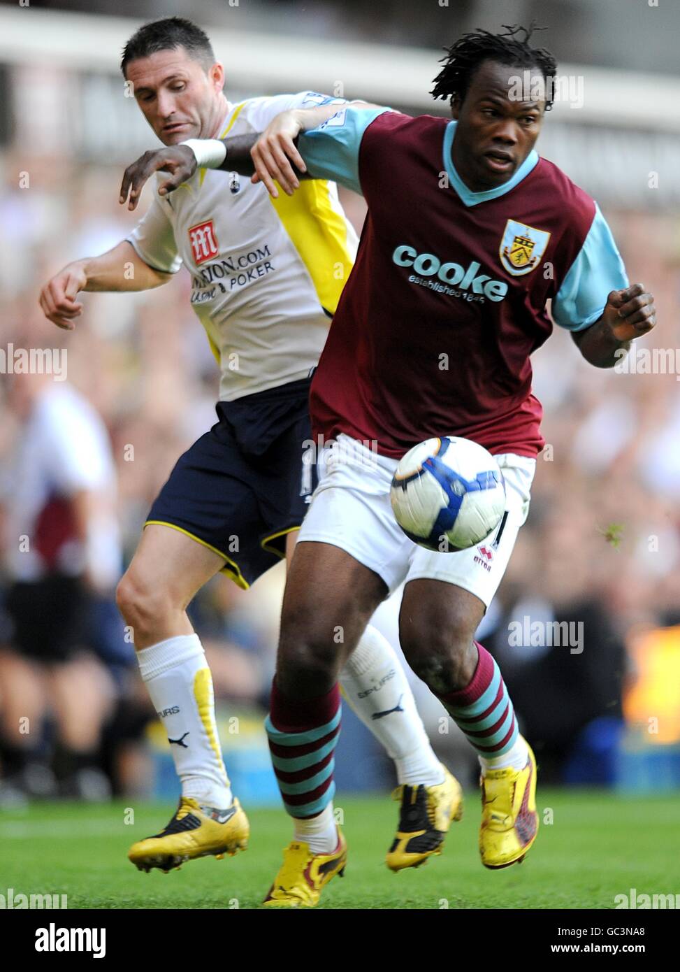 Burnley's Andre Bikey and Tottenham Hotspur's Robbie Keane (left ...