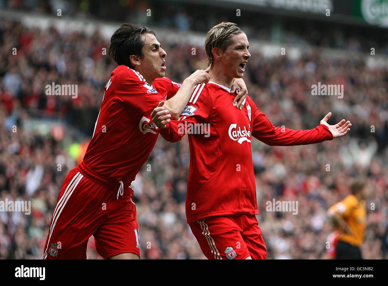 Liverpool's Fernando Torres (right) celebrates scoring his sides second ...
