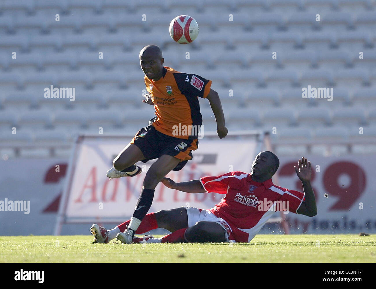 Barnet's Kenny Gillet and Rotherham United's Pablo Mills in action ...