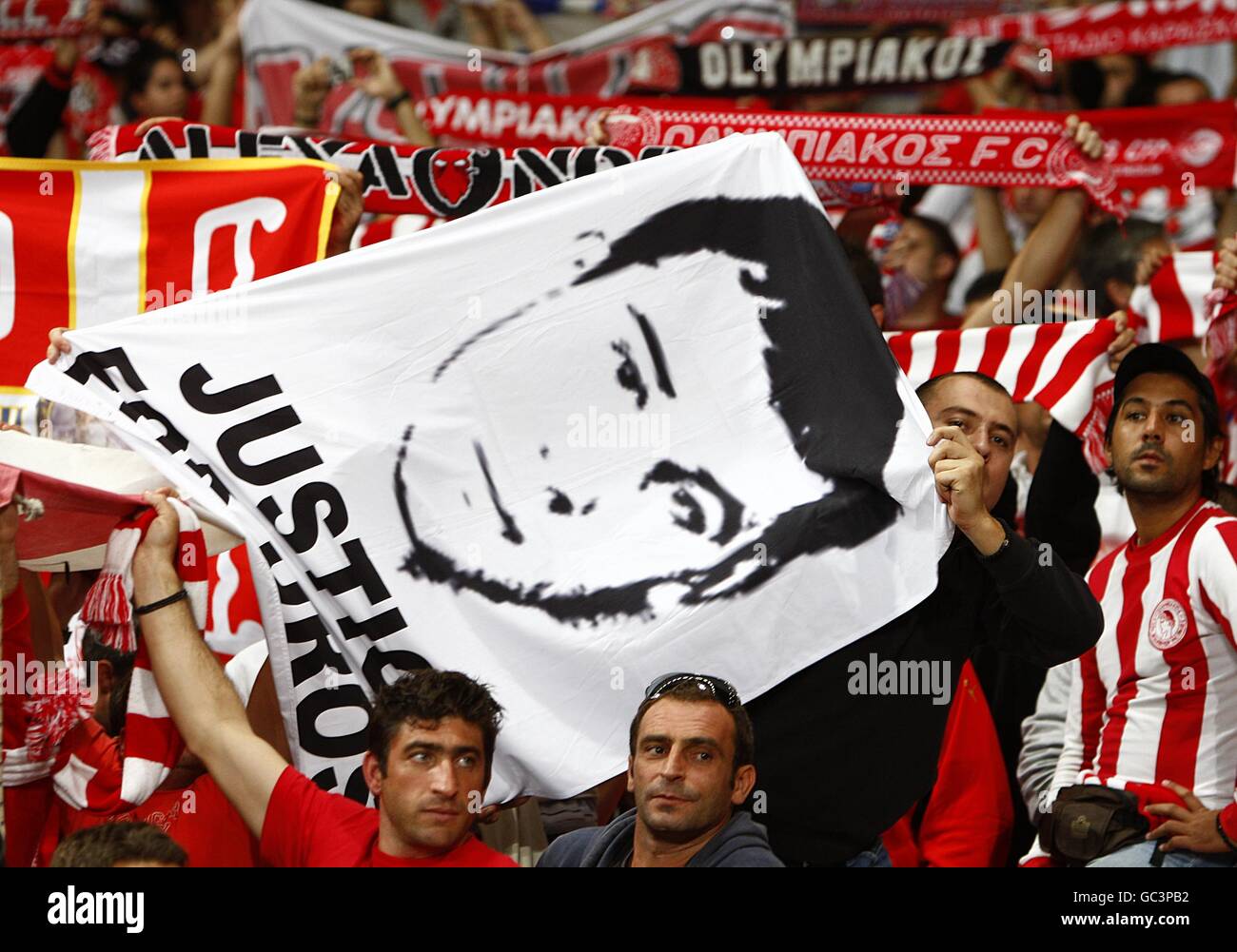 Emirates stadium olympiakos fans in the stands hi-res stock photography ...