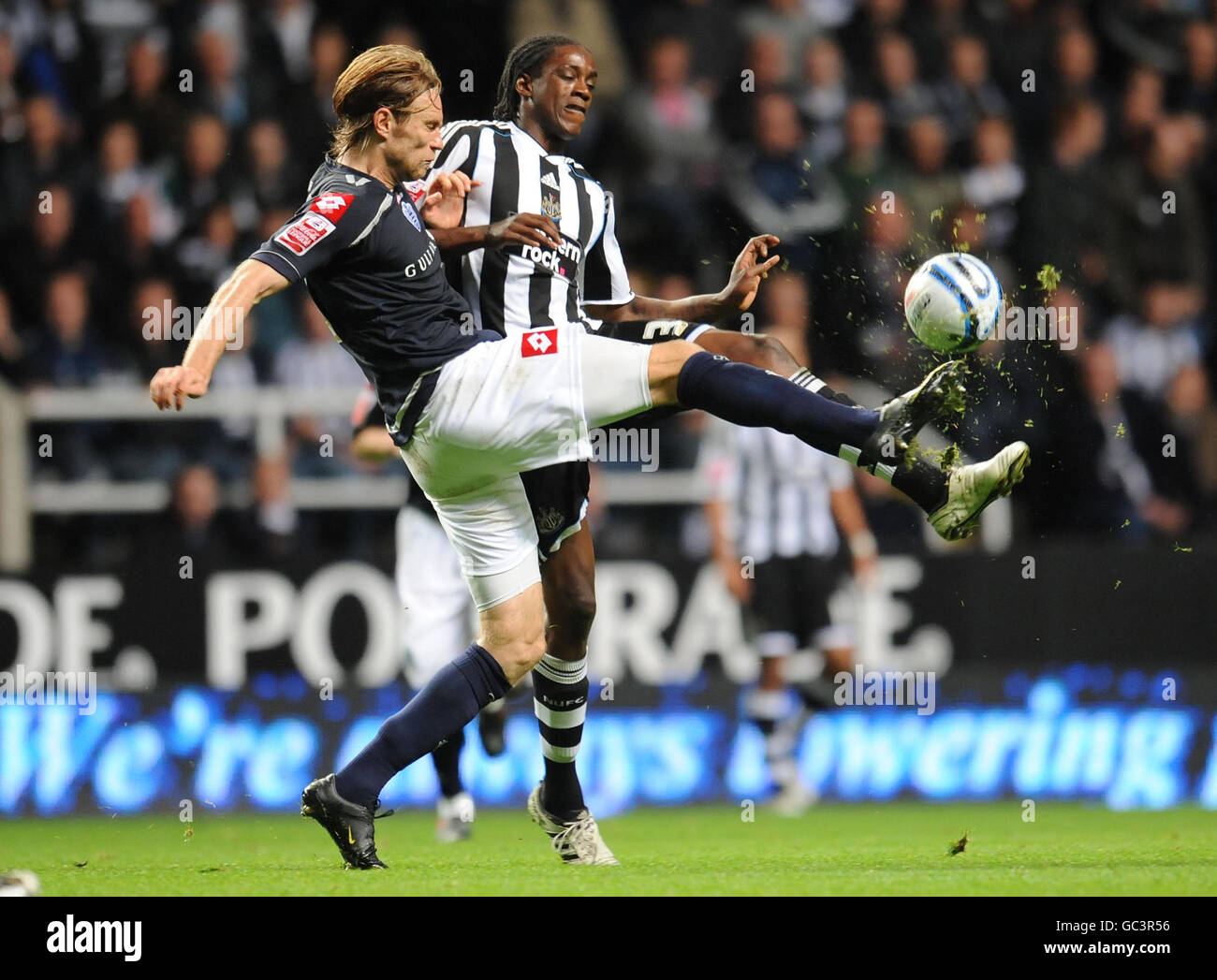 Newcastle United's Nile Ranger and Queens Park Rangers' Kaspars Gorkss ...
