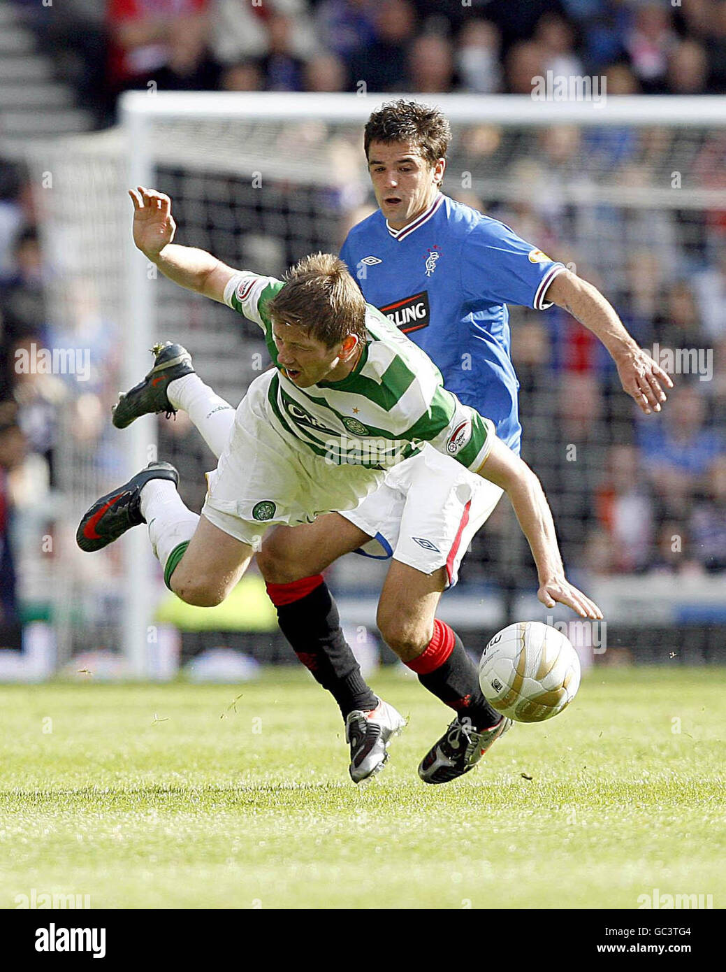 Celtic's Mark Wilson is tackled by Rangers Nacho Novo during the ...