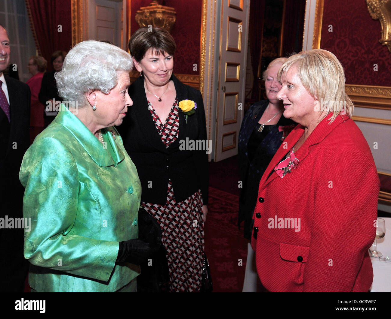 Queen Elizabeth II speaks with Mary O'Neil MBE, from Dungannon in ...