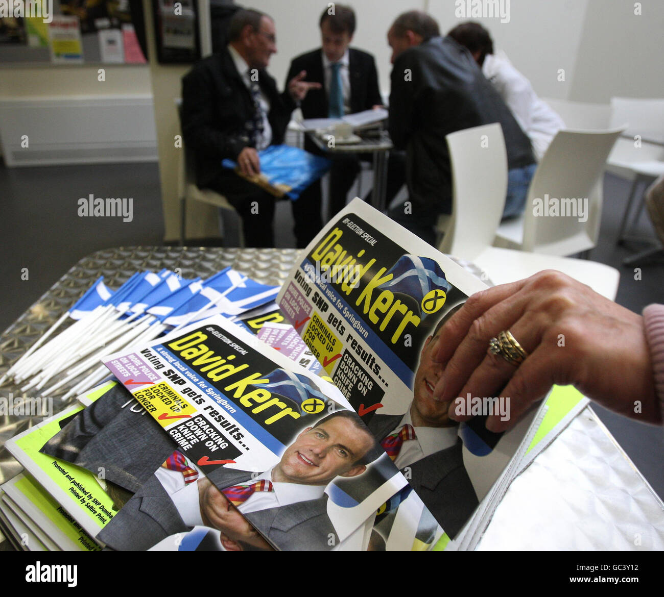 Leaflets are picked up from a table at the Milton Community Campus ...