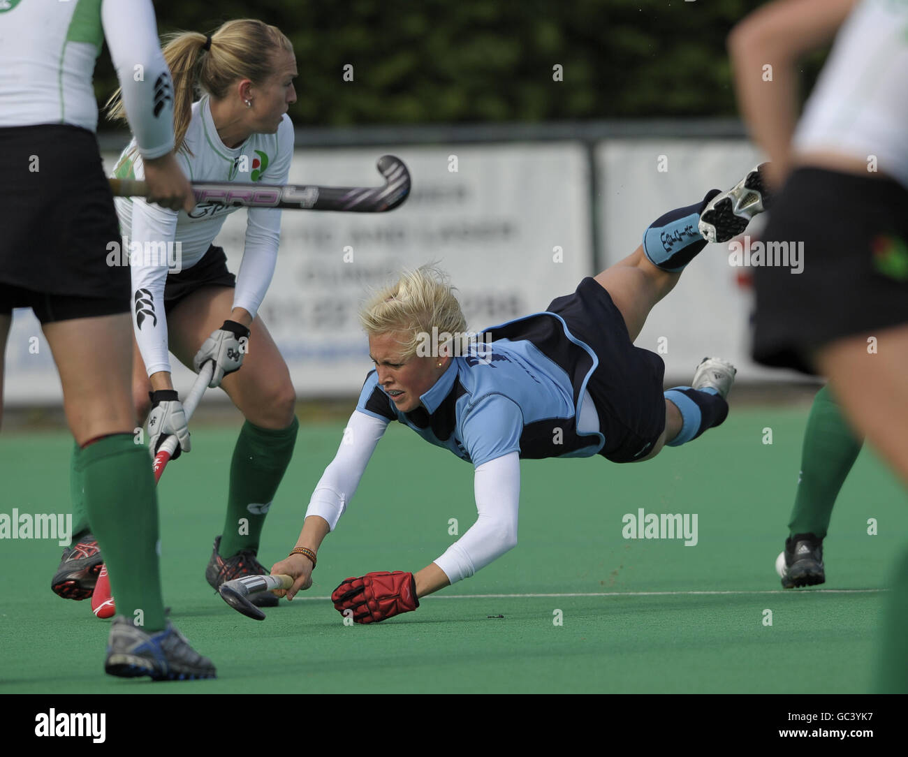 Reading's Alex Danson flies through the crowded Canterbury defence ...