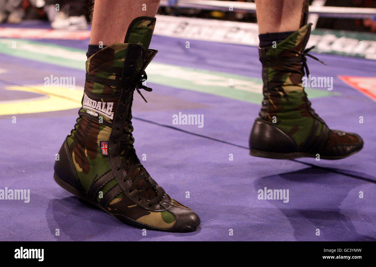 The boots of Great Britain's Michael Hunter as he takes on Jason Booth ...