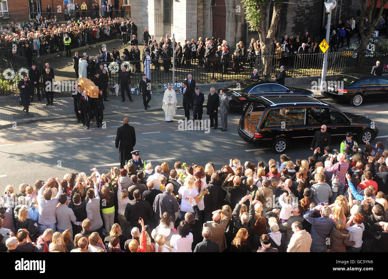 Boyzone members carry the coffin of Stephen Gately outside St Laurence ...