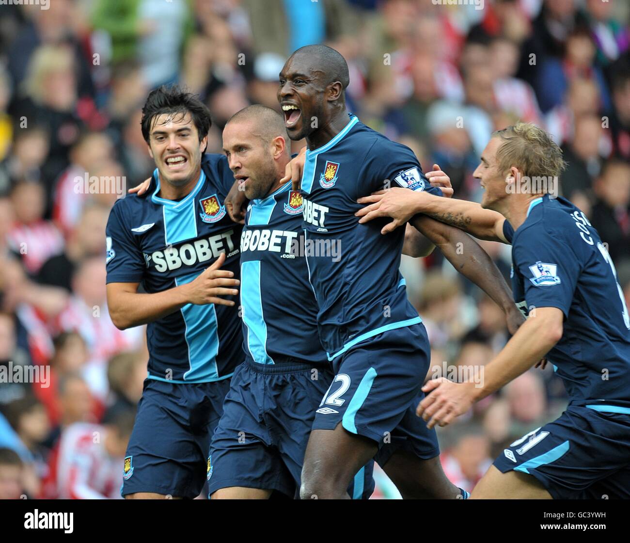 West Ham United's Matthew Upson (second left) celebrates scoring his ...