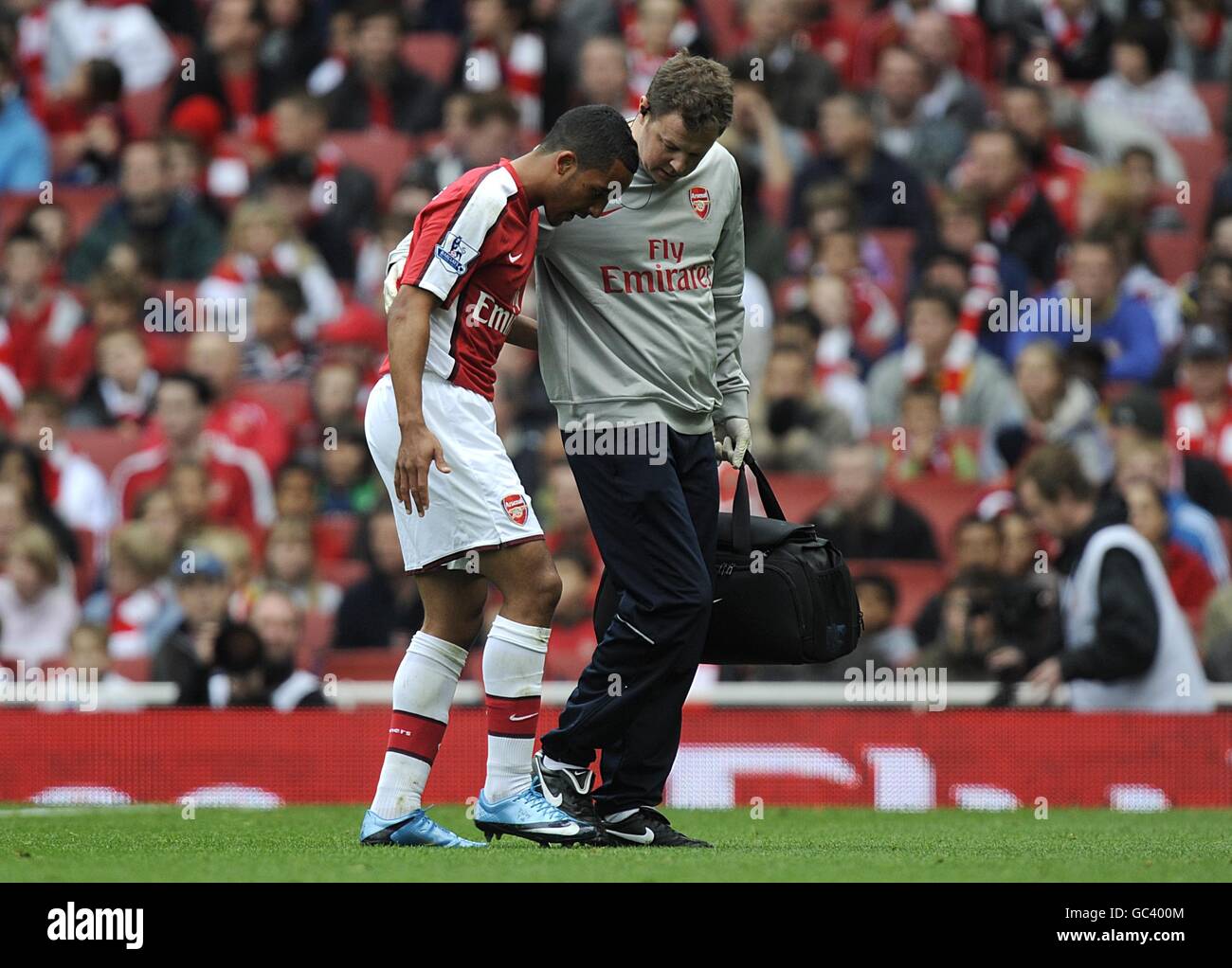 Arsenals theo walcott receives treatment on an injury hi-res stock ...