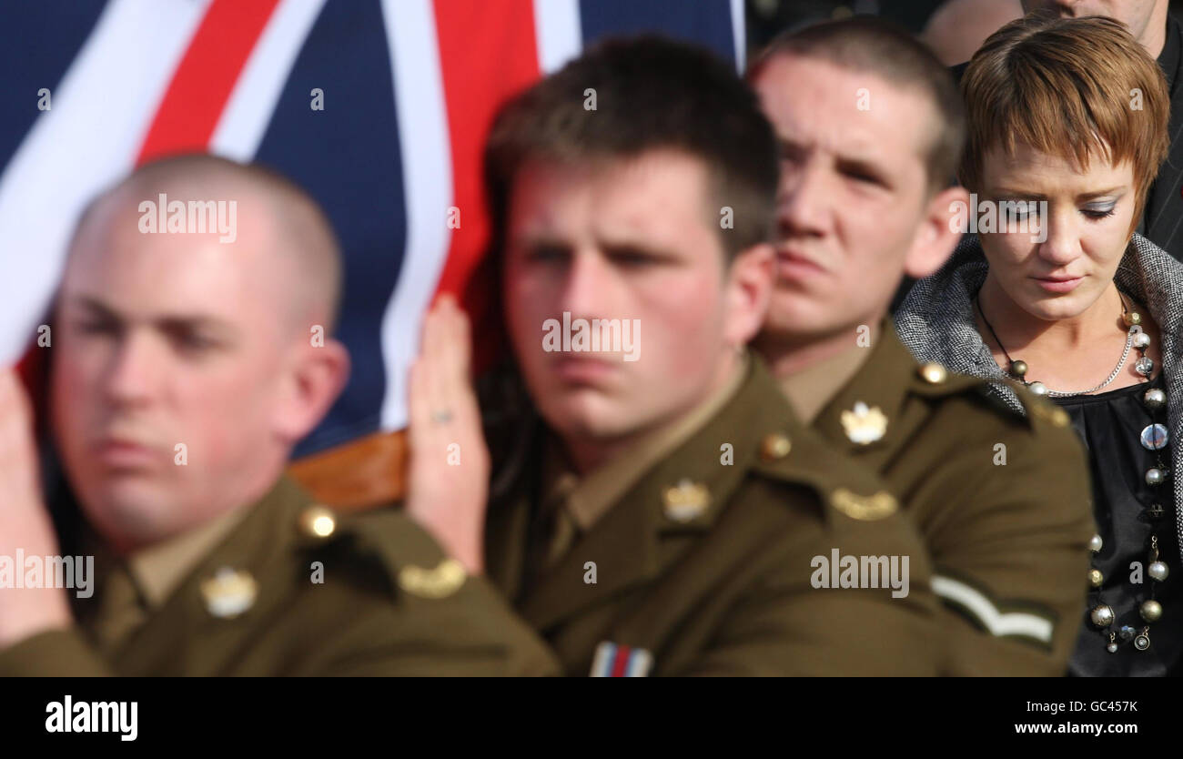 The coffin of Acting Sergeant Michael Lockett with his partner Belinda ...