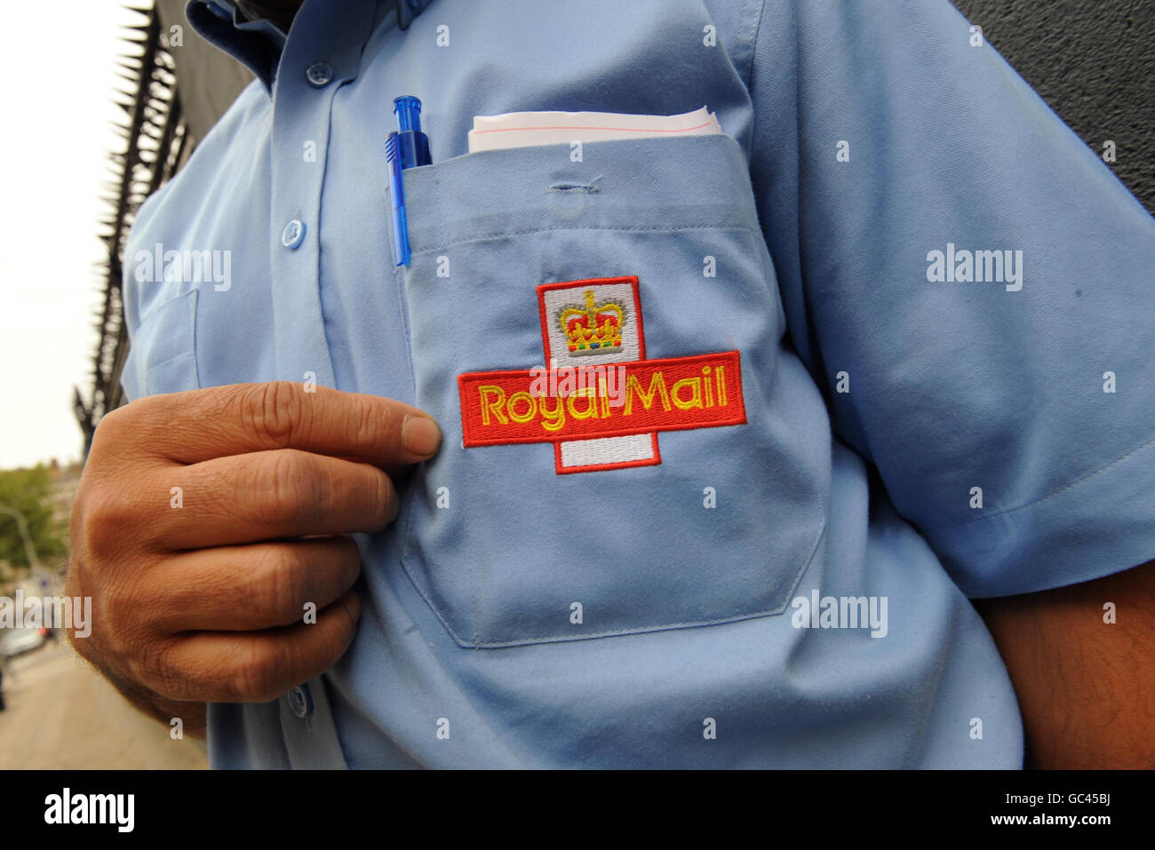 A Royal Mail worker at Mount Pleasant sorting office in London as ...