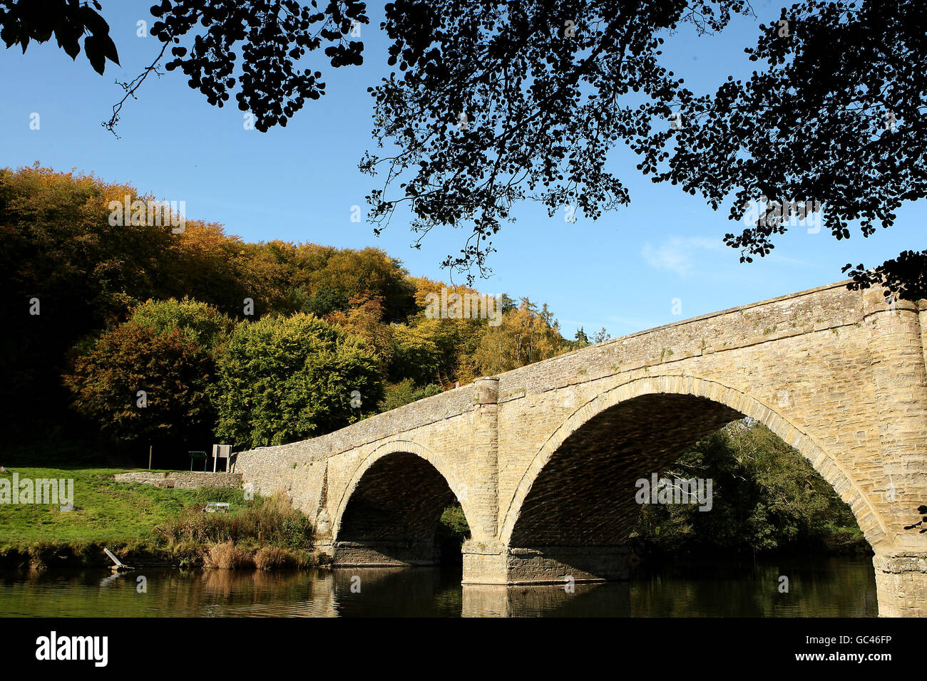 A general view of Dinham Bridge crossing the River Teme with autumn ...