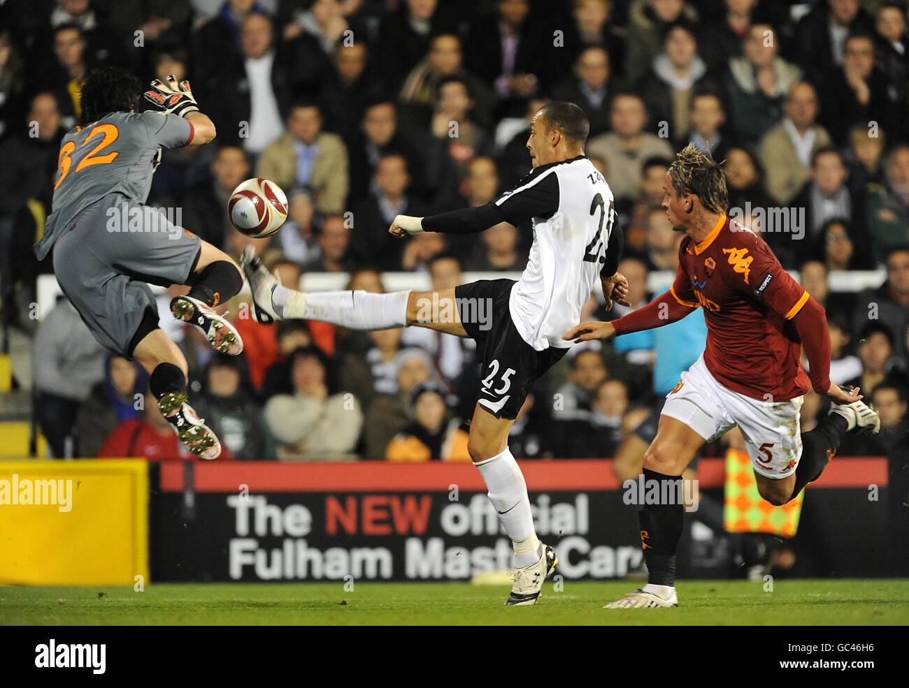 Roma goalkeeper Alexander Doni rushes out to block a shot from Fulham's ...