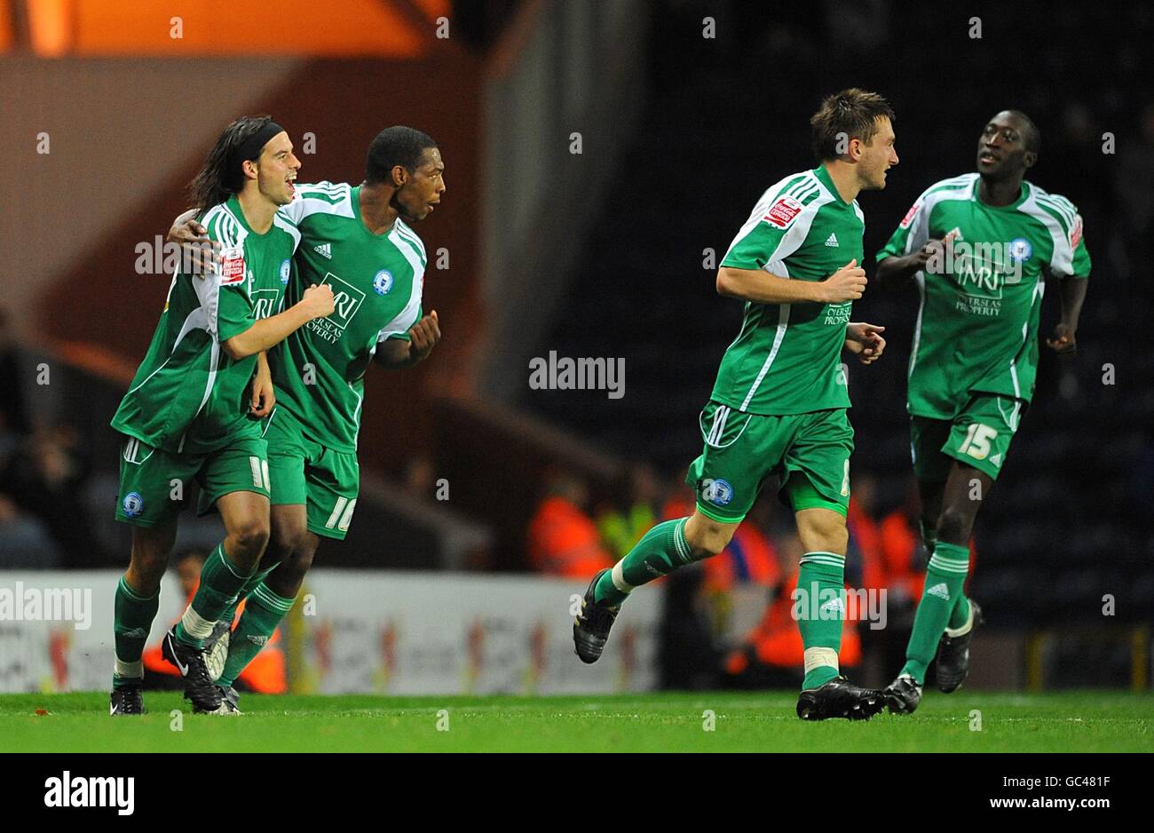 Peterborough United's George Boyd (far left) celebrates with his team ...