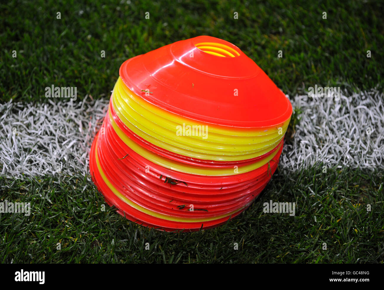 General view of a pile of training cones on a white line on the pitch ...
