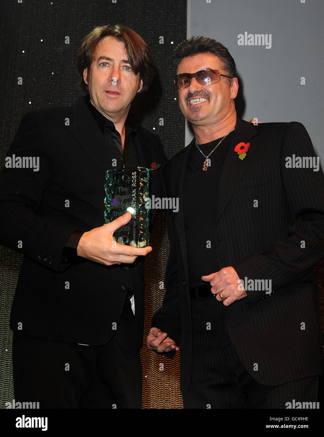 George Michael (right) presents Jonathan Ross with the 2009 Music ...