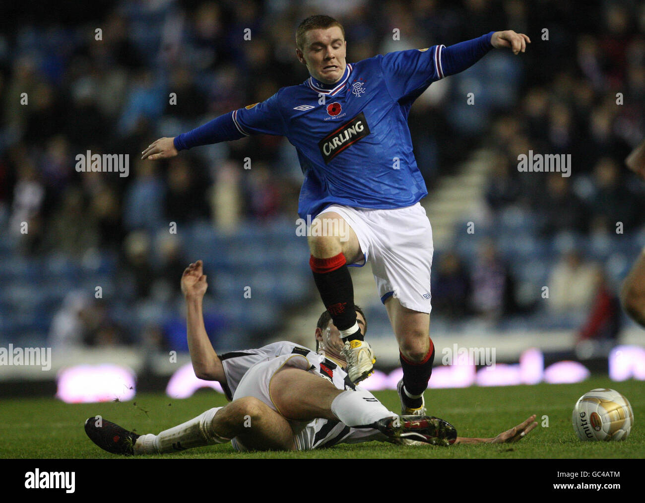 Rangers' John Fleck (right) is challenged by St Mirren's Chris Innes ...