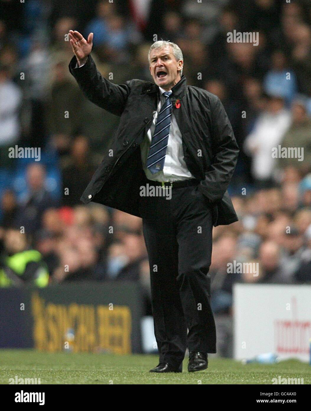 Manchester city manager mark hughes on touchline hi-res stock ...