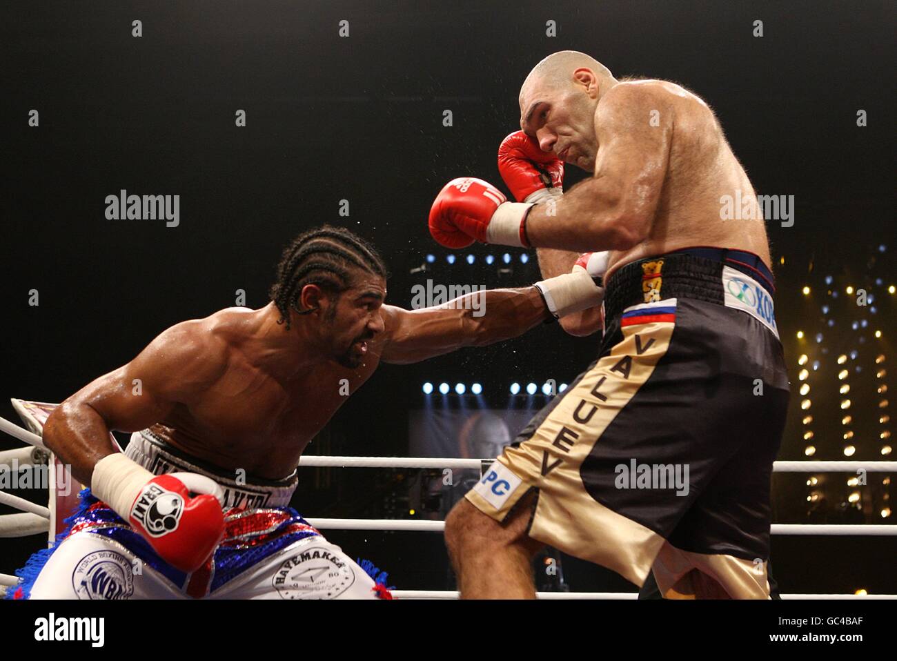 England's David Haye (left) on top against Russia's Nikolai Valuev ...