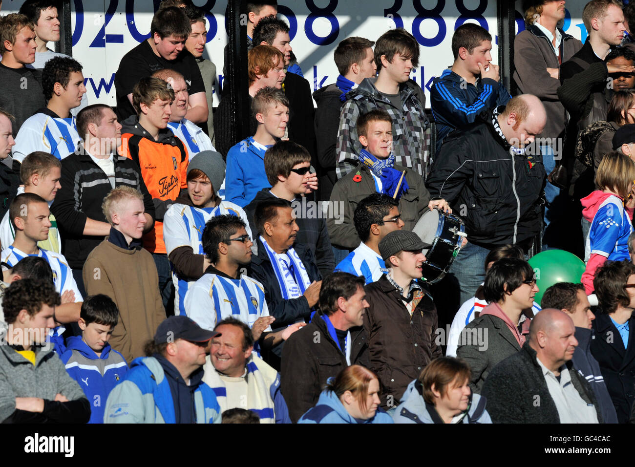 Colchester united fans cheer on their side in the stands hi-res stock ...