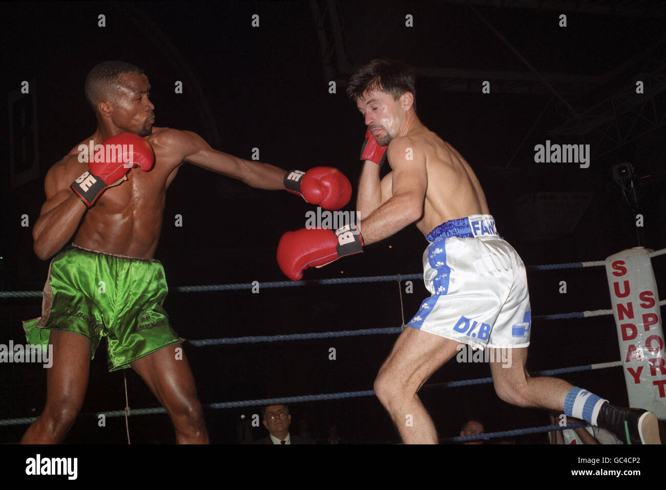 COLIN MCMILLAN (L) THROWS A PUNCH AT ITALY'S MAURIZIO (R) STECCA DURING ...