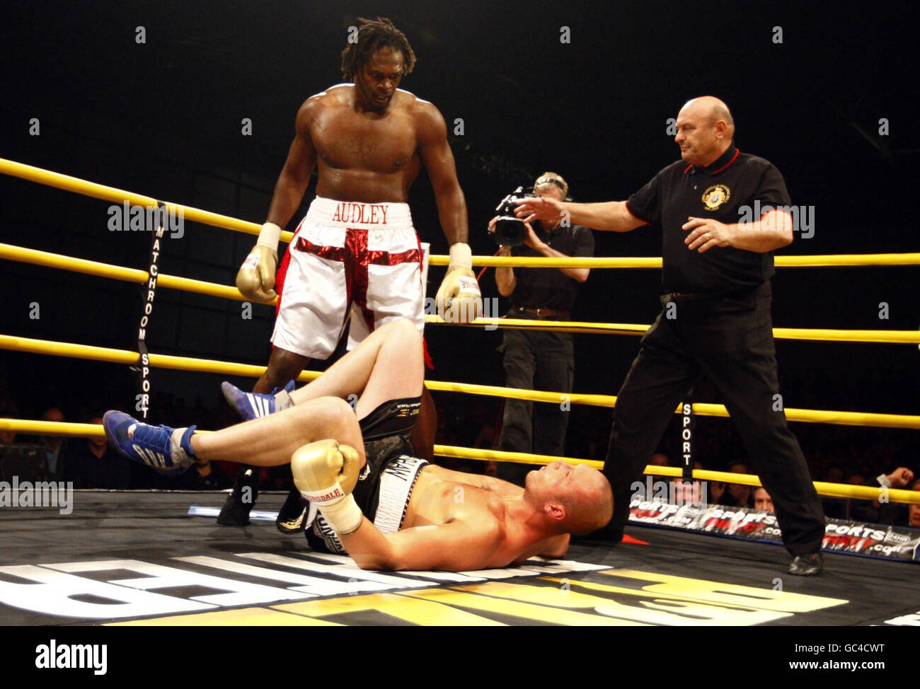 Audley Harrison stands over Scott Belshaw after knocking him down ...