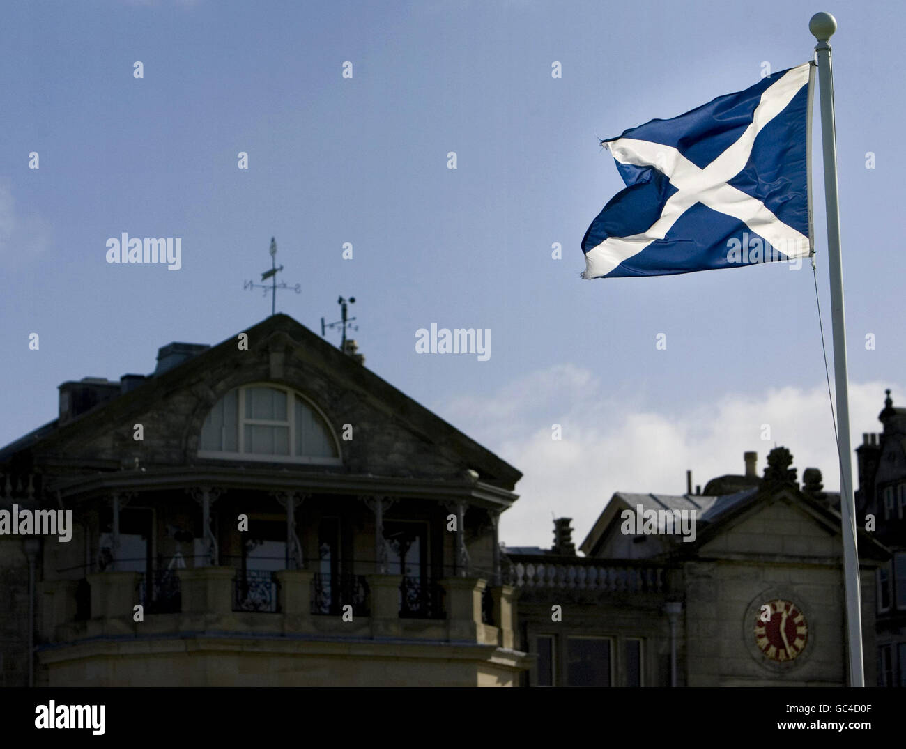 Flags blow in the gale force winds that forced the cancellation of the ...
