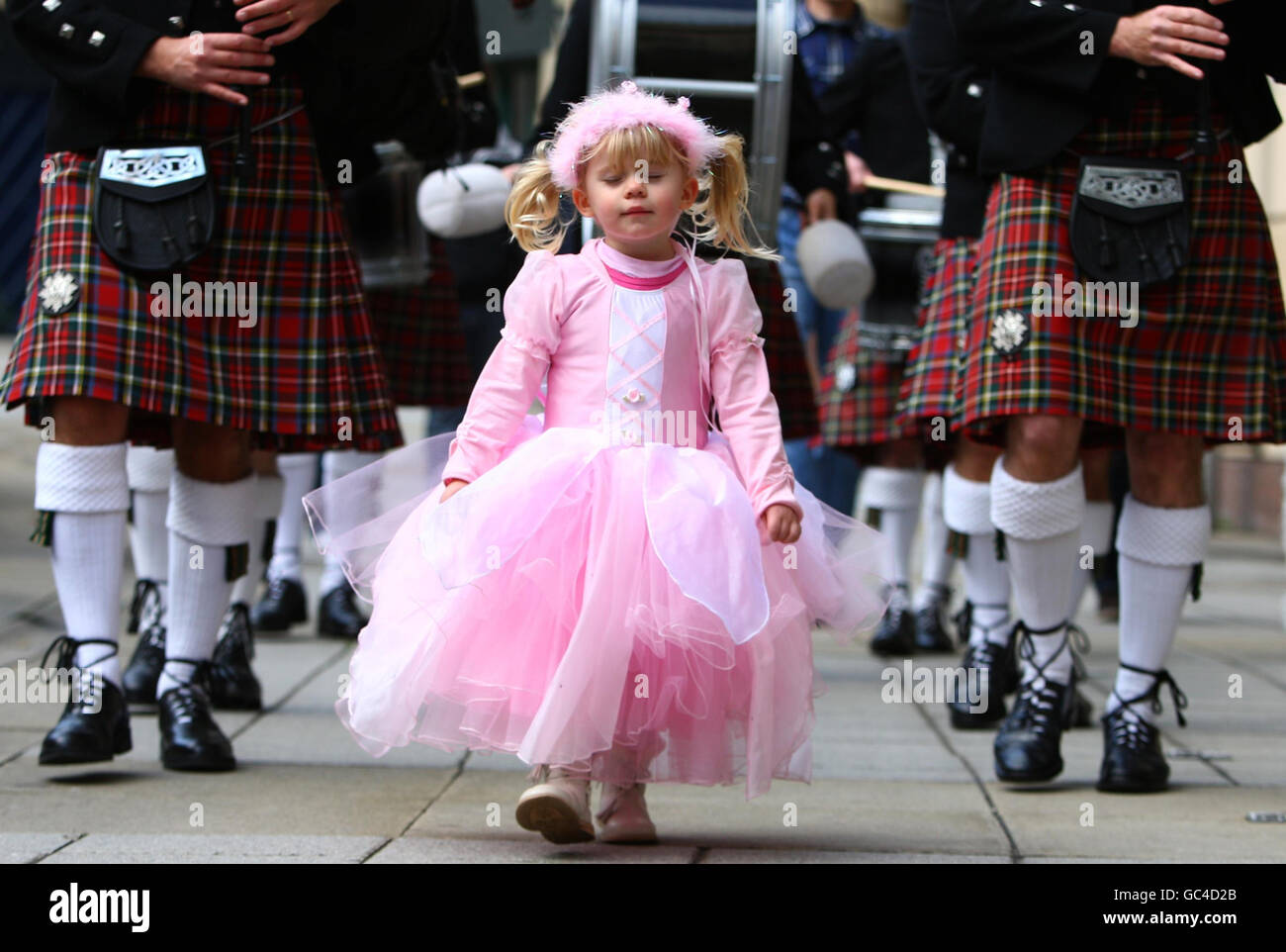 Two and Half year old Alexa Anderson from Edinburgh listens to the ...