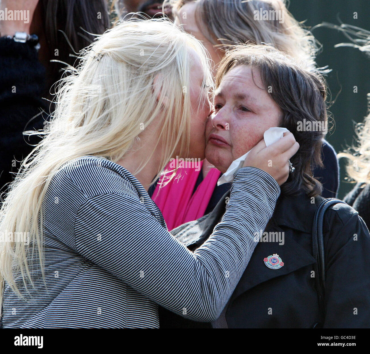Jaime Quinsey, sister of dead soldier Mark Quinsey, comforts her mother ...