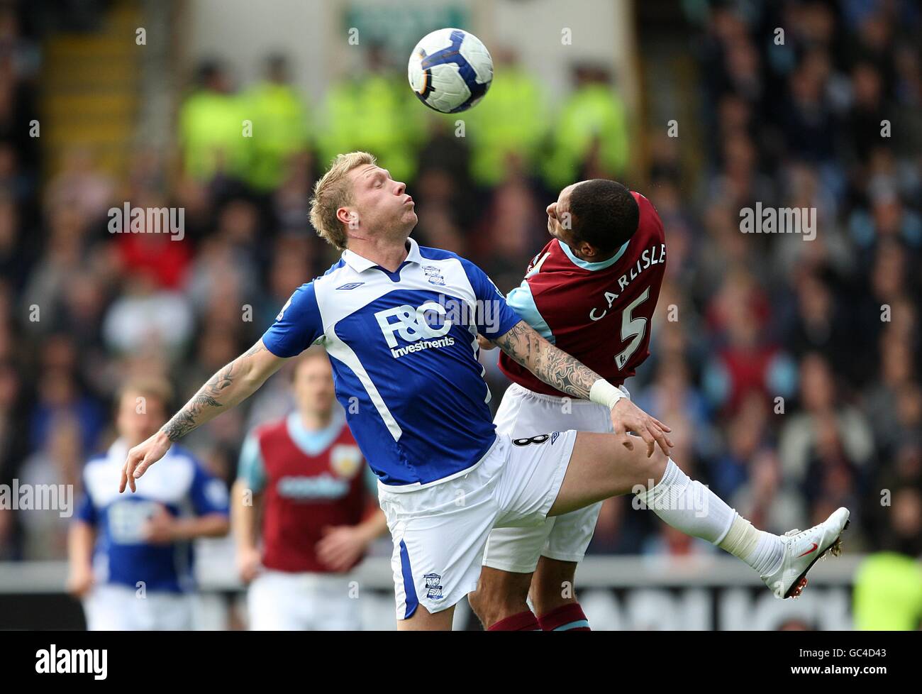Birmingham City's Garry O'Connor (left) and Burnley's Clarke Carlisle ...