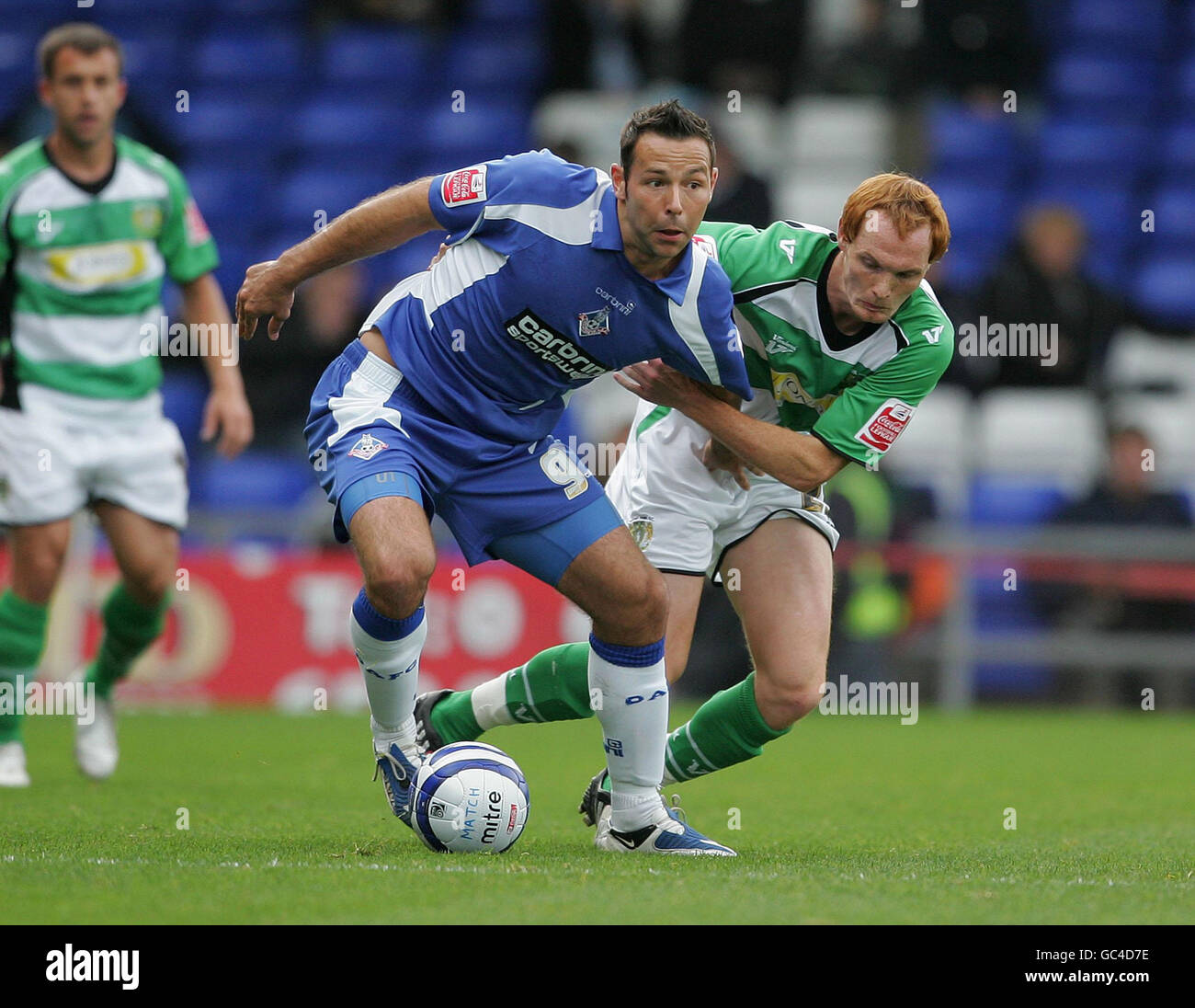 Oldham Athletic's Pawel Abbott and Yeovil Town's Shaun MacDonald during ...