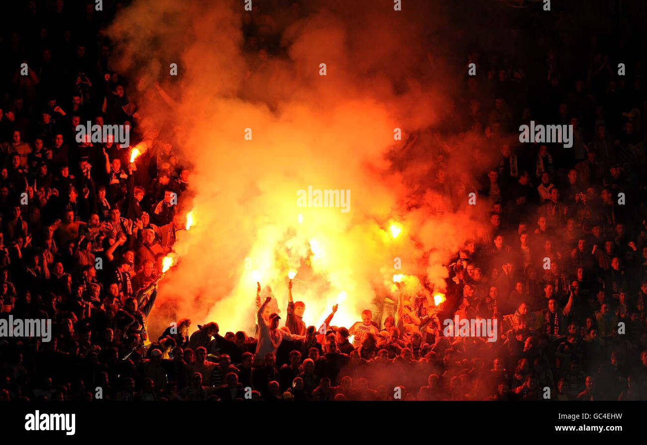 Flares are held by fans in the stands during the FIFA World Cup ...