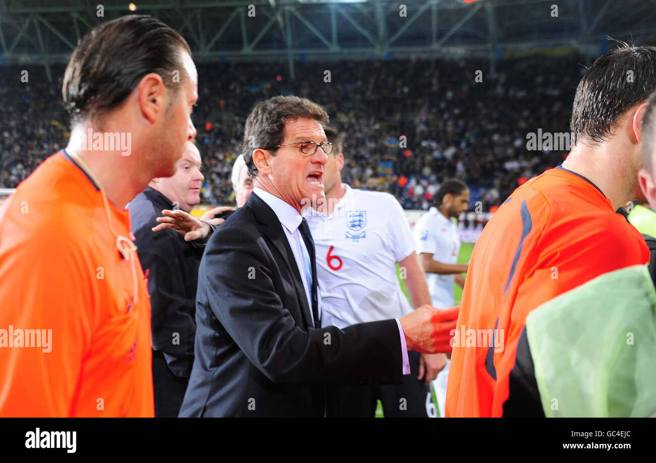 England manager Fabio Capello goes to speak with the referee during the ...