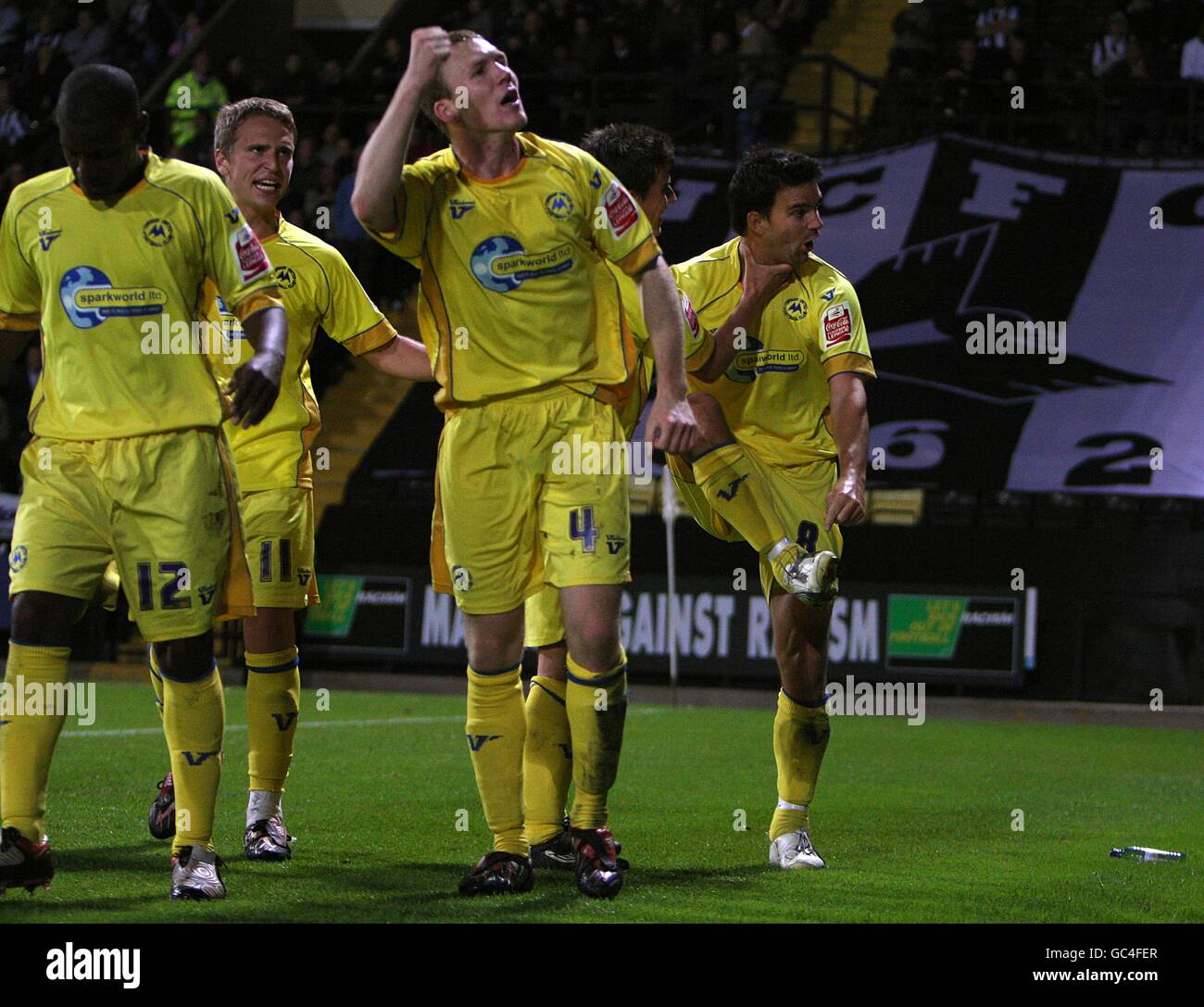 Torquay United's Tim Sills (right) celebrates with his team mates after ...