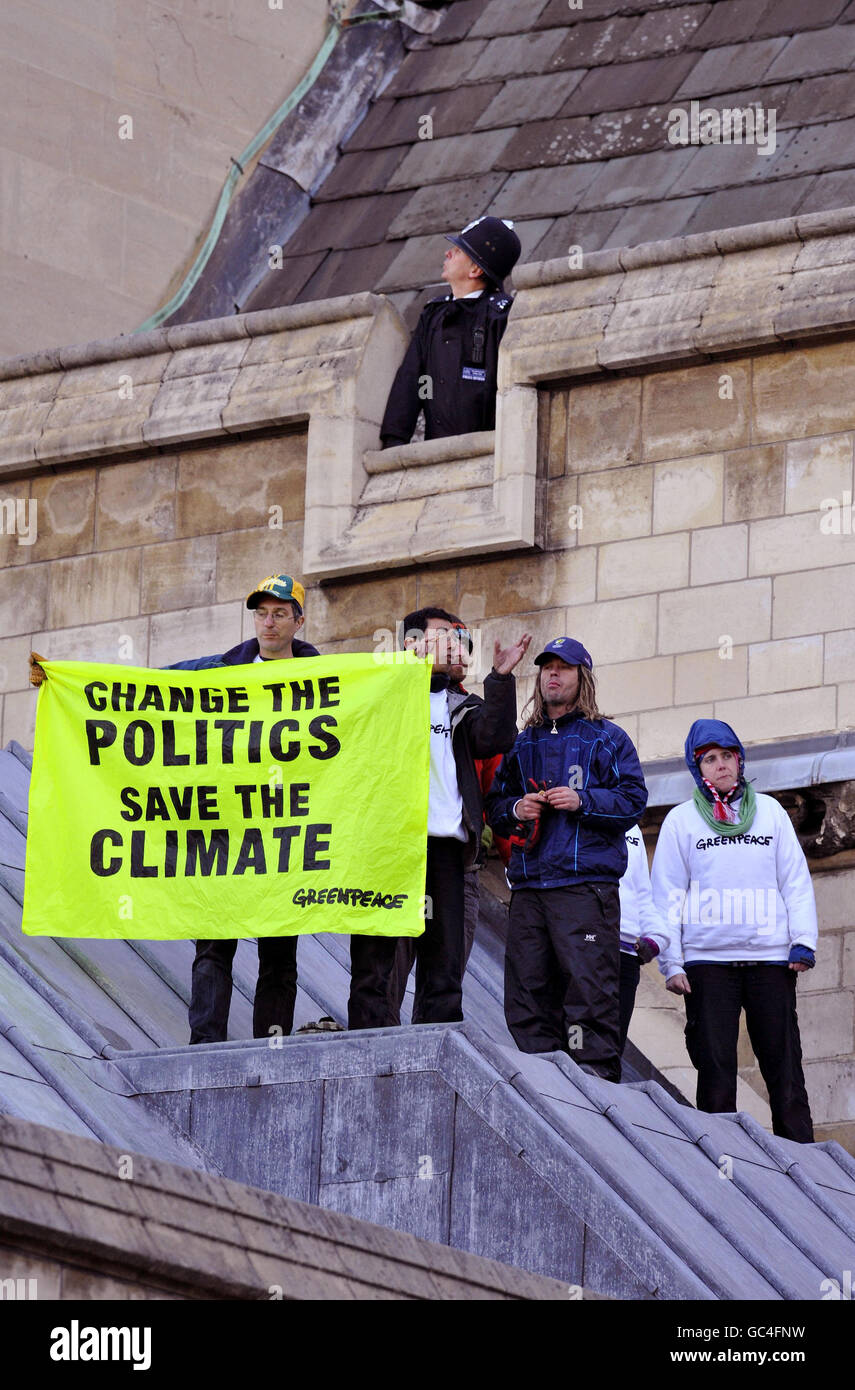 Climate change protest on roof houses parliament hi-res stock ...